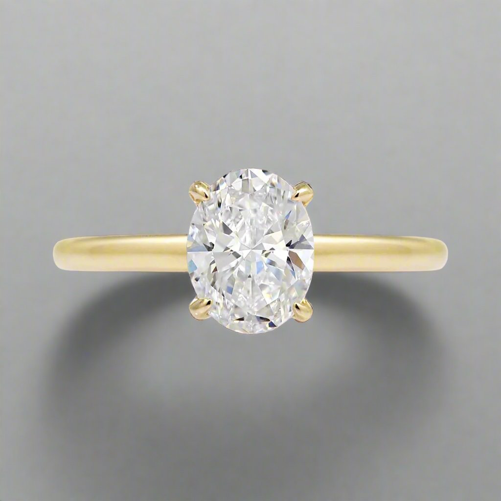The Lucy Oval Diamond Engagement Ring With Diamond Accent